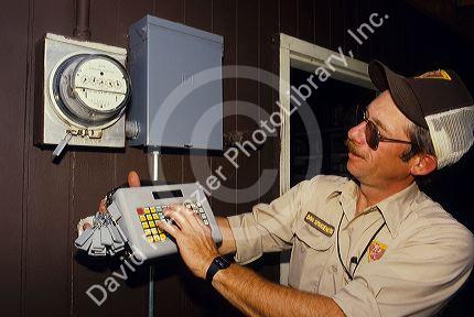 Power company meter reader. | David R. Frazier Photolibrary, Inc.